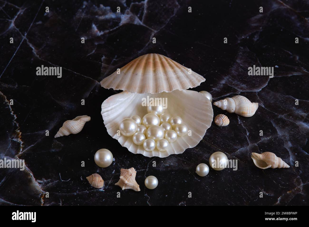 a few pearls in a sea shell Stock Photo - Alamy