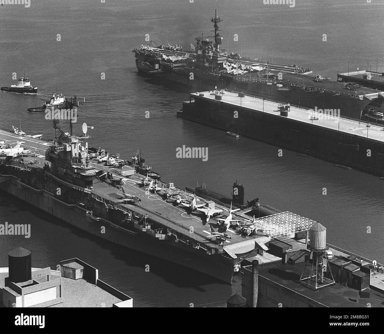 The aircraft carrier USS FORRESTAL (CV-59) departs its berth at the ...