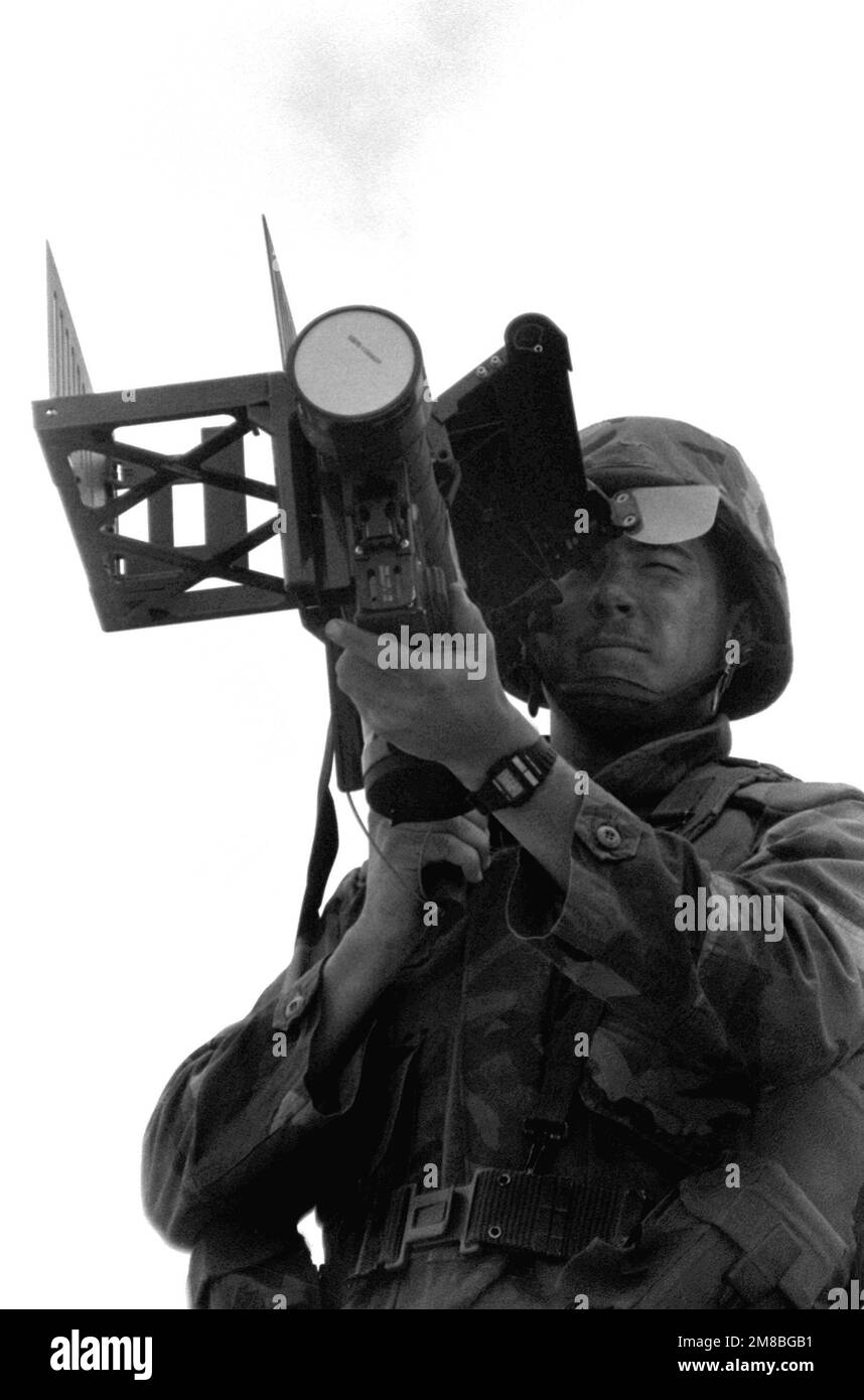 A Marine aims a FIM-92 Stinger portable anti-aircraft missile launcher ...