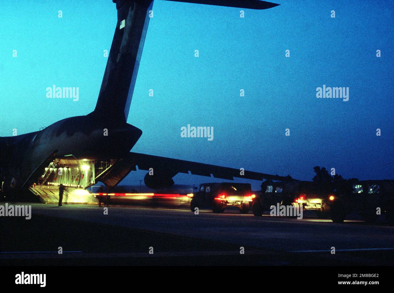 Elements of the 7th Light Infantry Division drive M998 High-Mobility ...