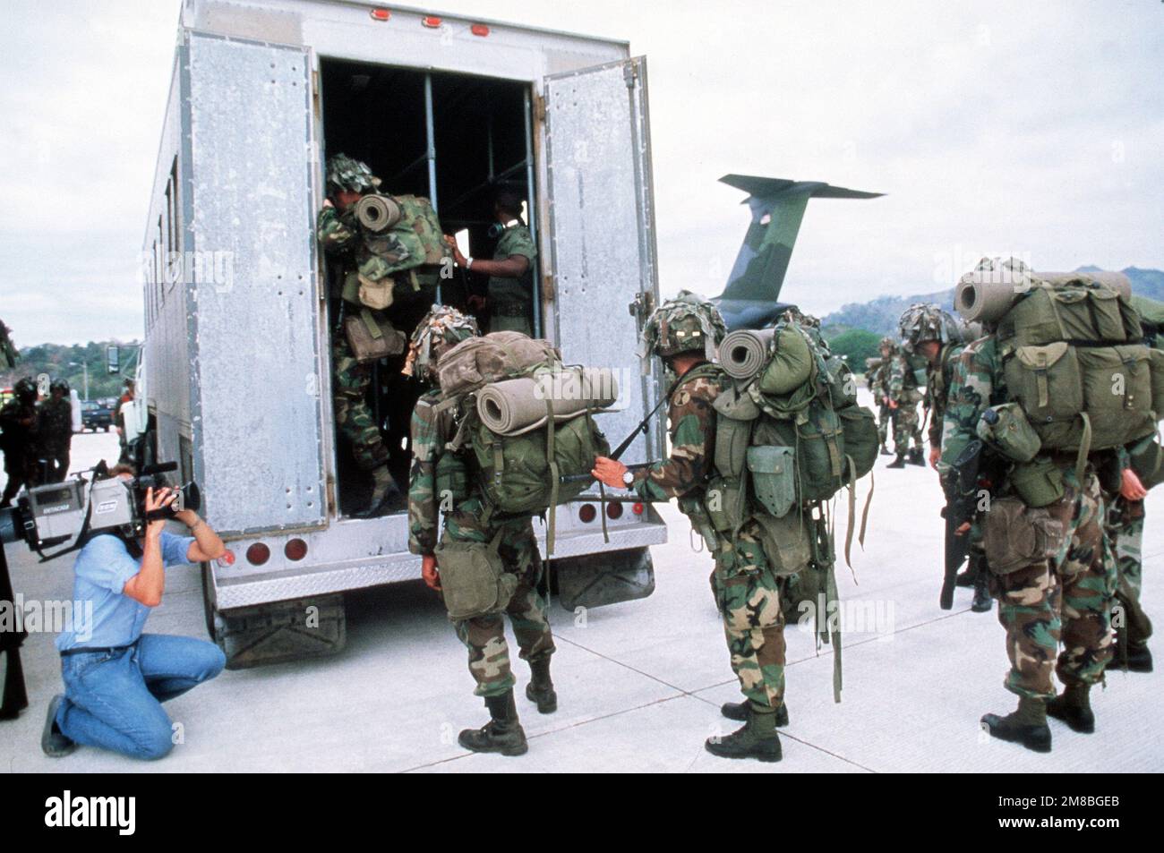 A member of the 1369th Audiovisual Squadron, U.S. Air Force, films ...