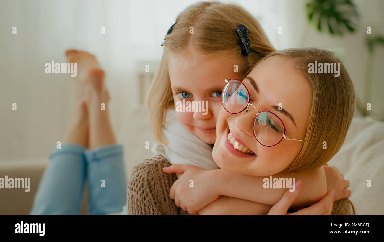 Caucasian family closeness. Little cute daughter kid baby girl embrace ...
