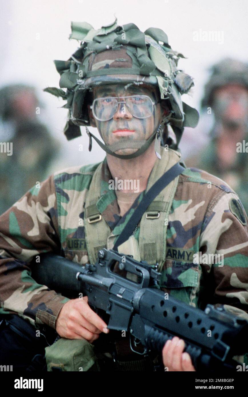 A soldier of the 7th Light Infantry Division carries an M-16A2 rifle ...