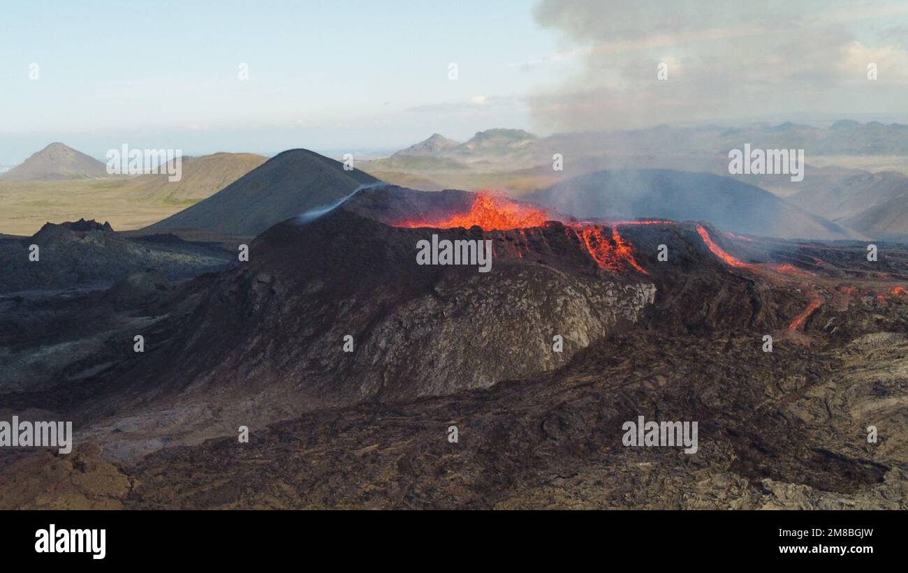 A landscape of erupting Mauna Loa Volcano in Hawaii with smoke under ...