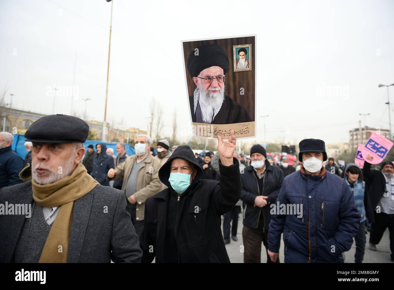 Tehran, Tehran, Iran. 13th Jan, 2023. A man holds up a poster showing ...