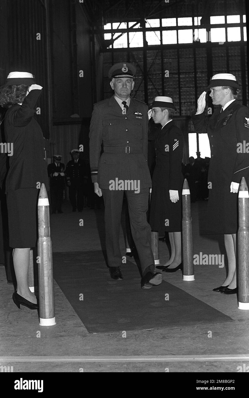 An unidentified British Royal Air Force general officer passes through ...