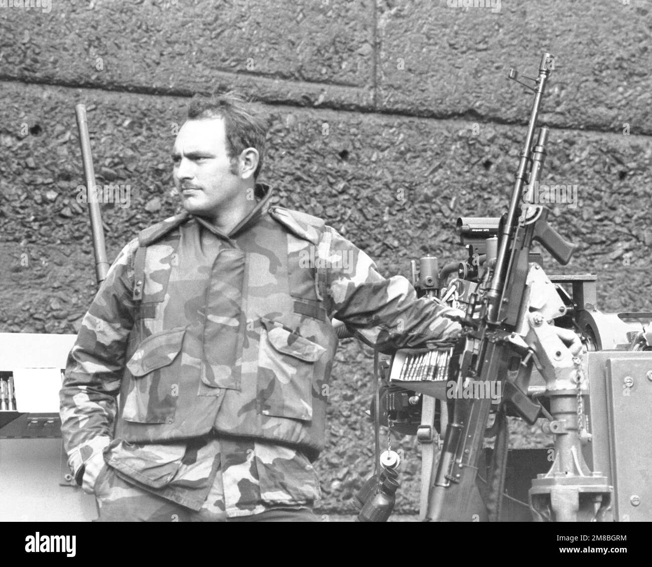 A member of Special Boat Unit 26 (SBU-26) rests his arm on a 7.62mm M ...