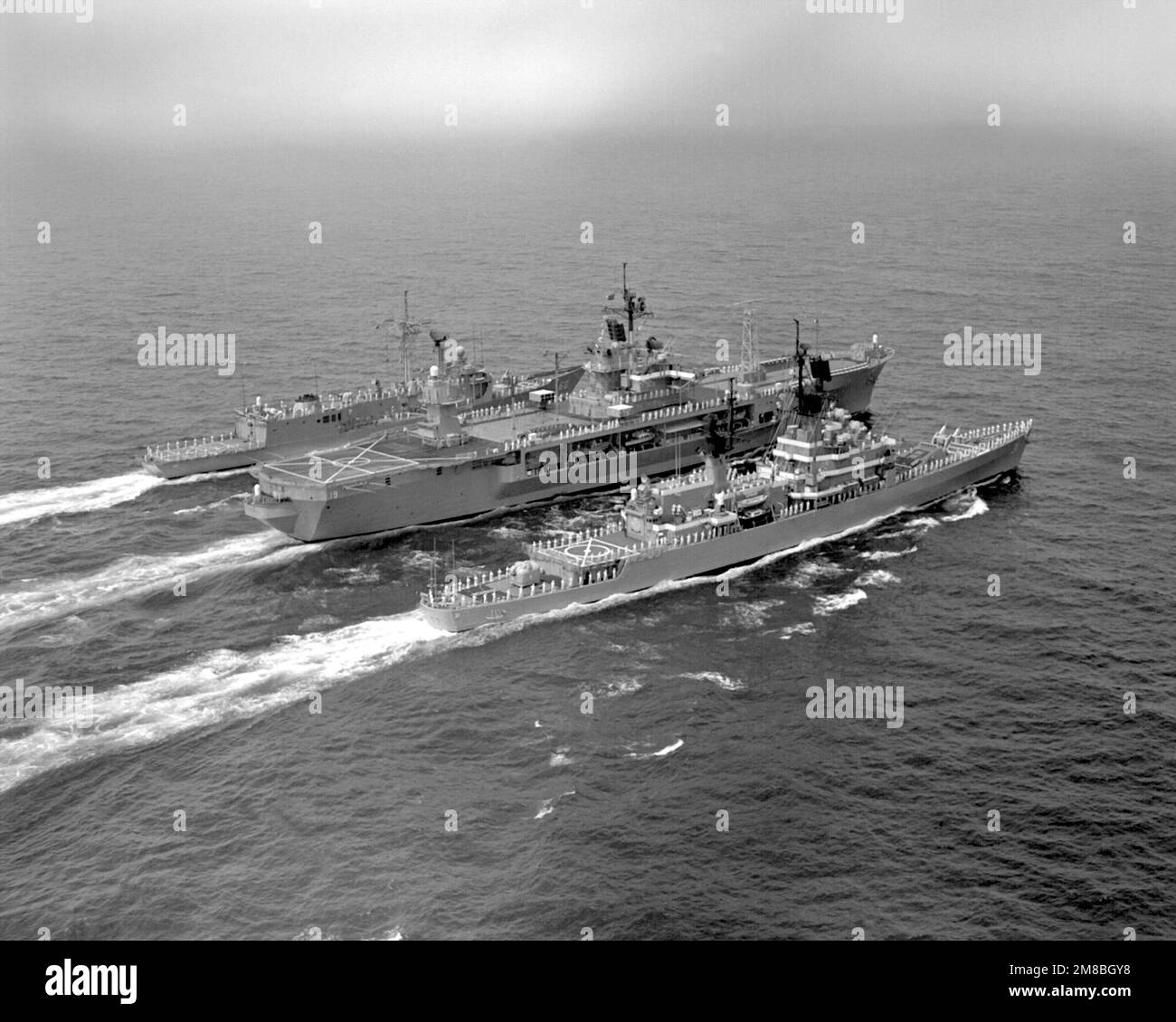 Officers and sailors man the rails of the amphibious command ship USS ...