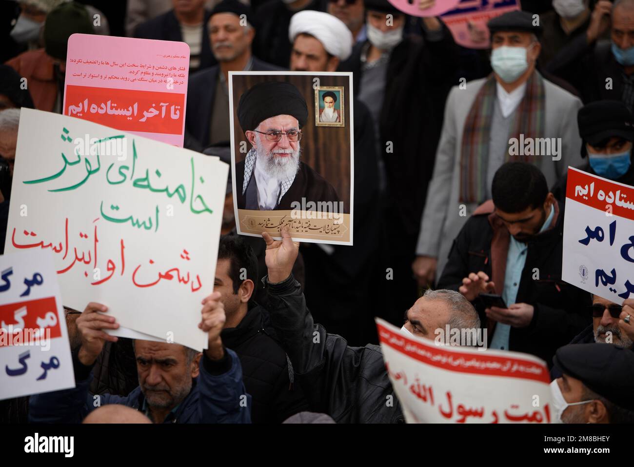 Tehran, Tehran, Iran. 13th Jan, 2023. A man holds up a poster showing ...
