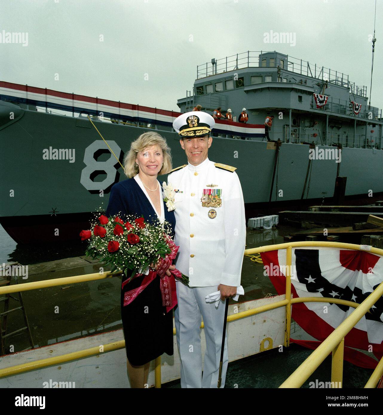 Mrs. Linda L. Hogan, ship's sponsor, poses for a picture with Rear ...