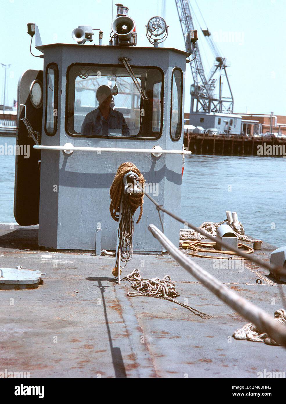 A petty officer 2nd class serves as coxswain of an LCM-8 mechanized ...