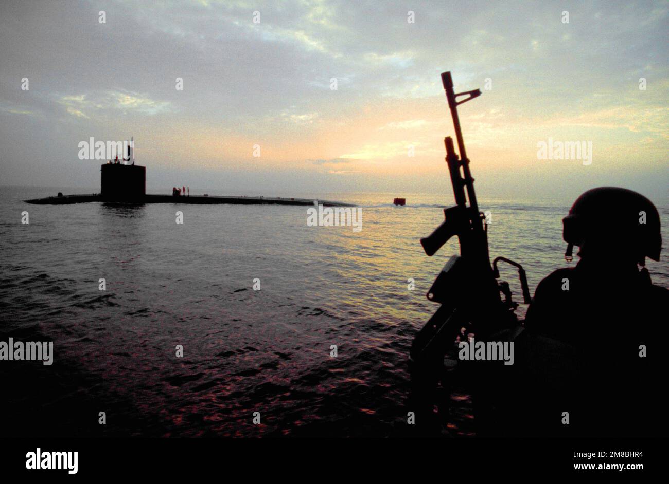 Manning his M-60 lightweight machine gun, a crewman on a PBR Mark 2 ...