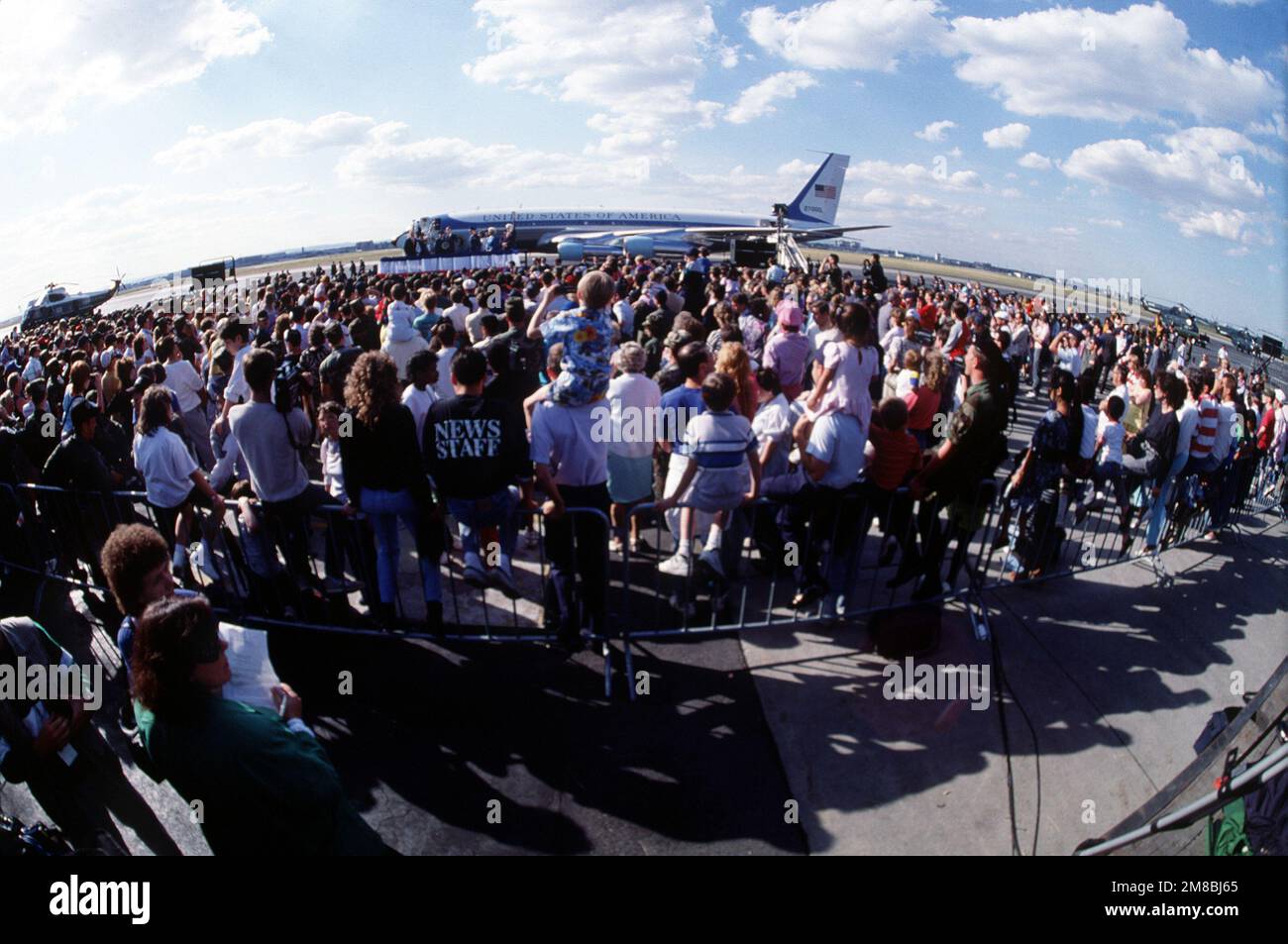 A crowd gathers to listen to a speech by President George H.W. Bush ...