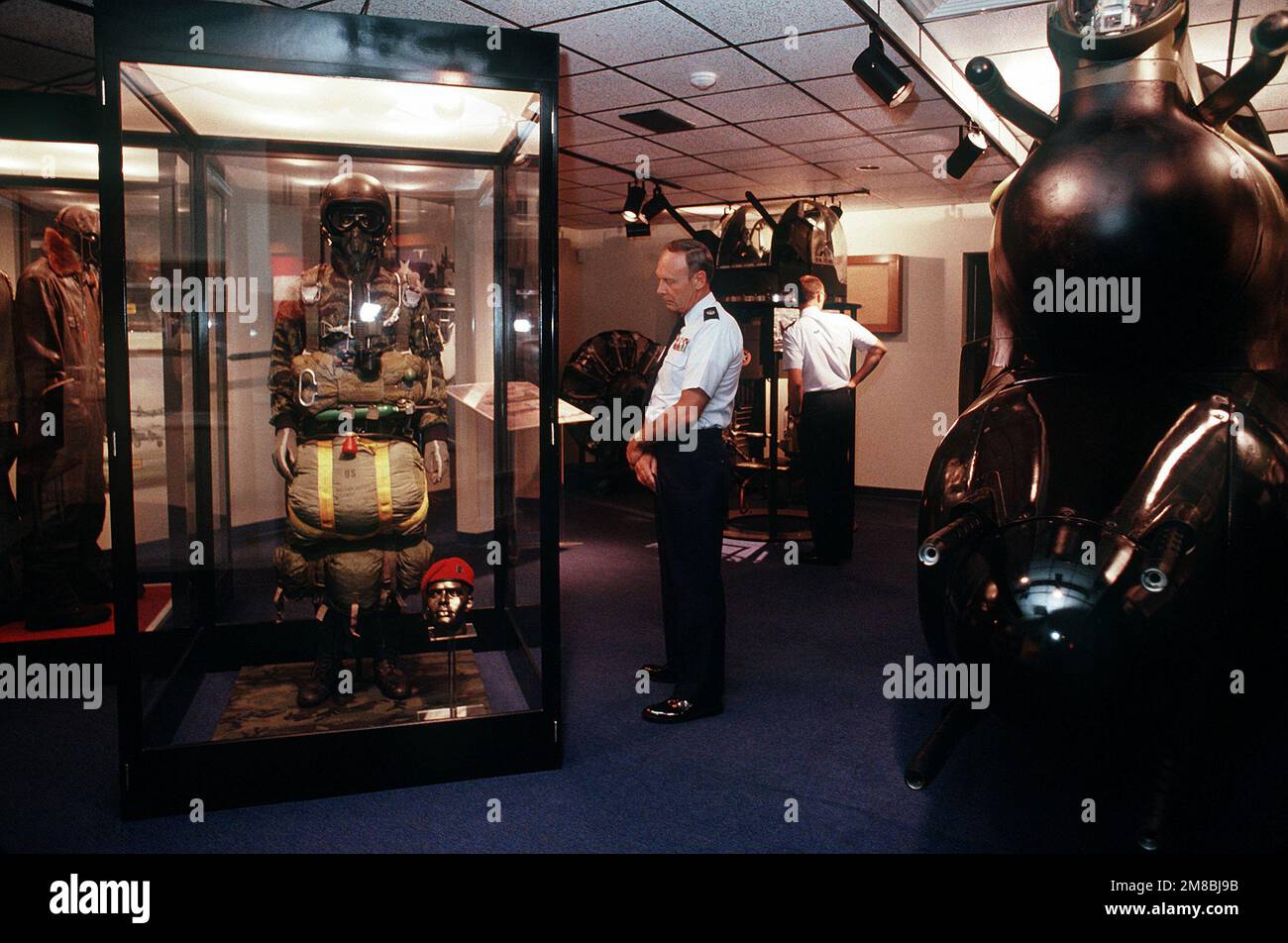 An officer studies a parachutist display at the Air Force Enlisted ...