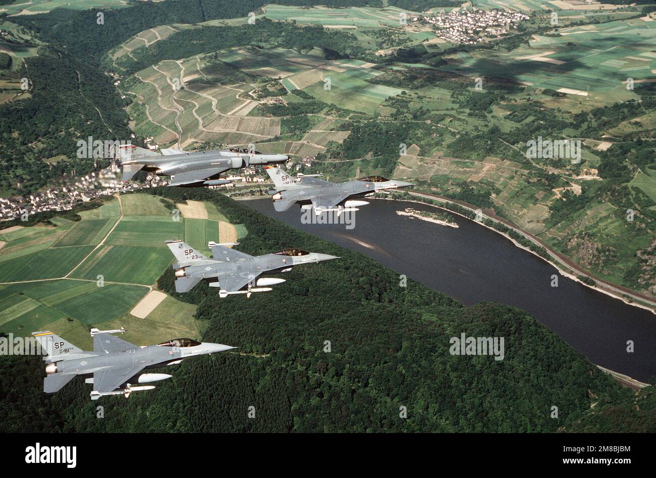 Three F-16C Fighting Falcon aircraft and one F-4G Phantom II Wild ...