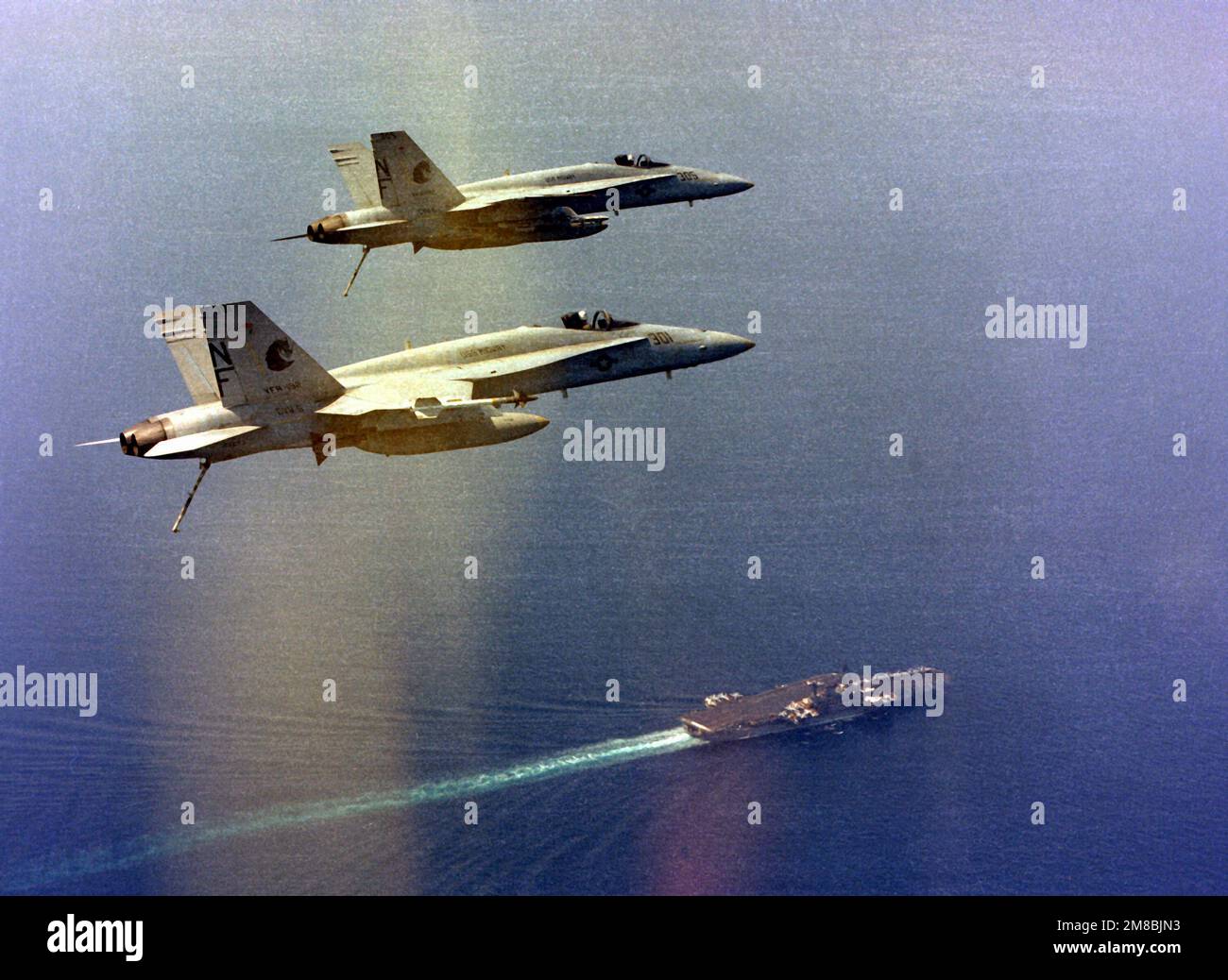 A pair of F/A-18A Hornet aircraft from Strike Fighter Squadron 192 (VFA ...