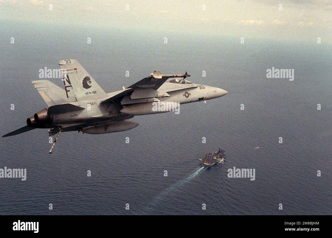 Its tail hook down, an F/A-18A Hornet aircraft from Strike Fighter ...