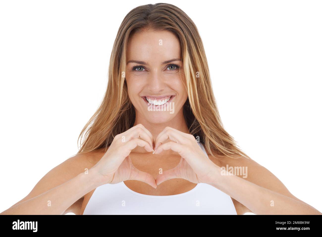 Portrait, hand and heart by woman in studio happy, relax and smile ...