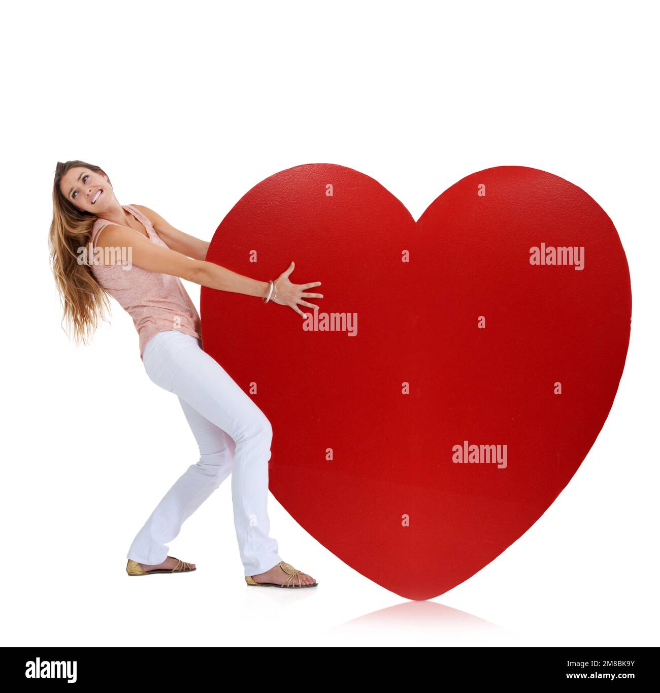 Love, studio and woman pull heart isolated on a white background ...