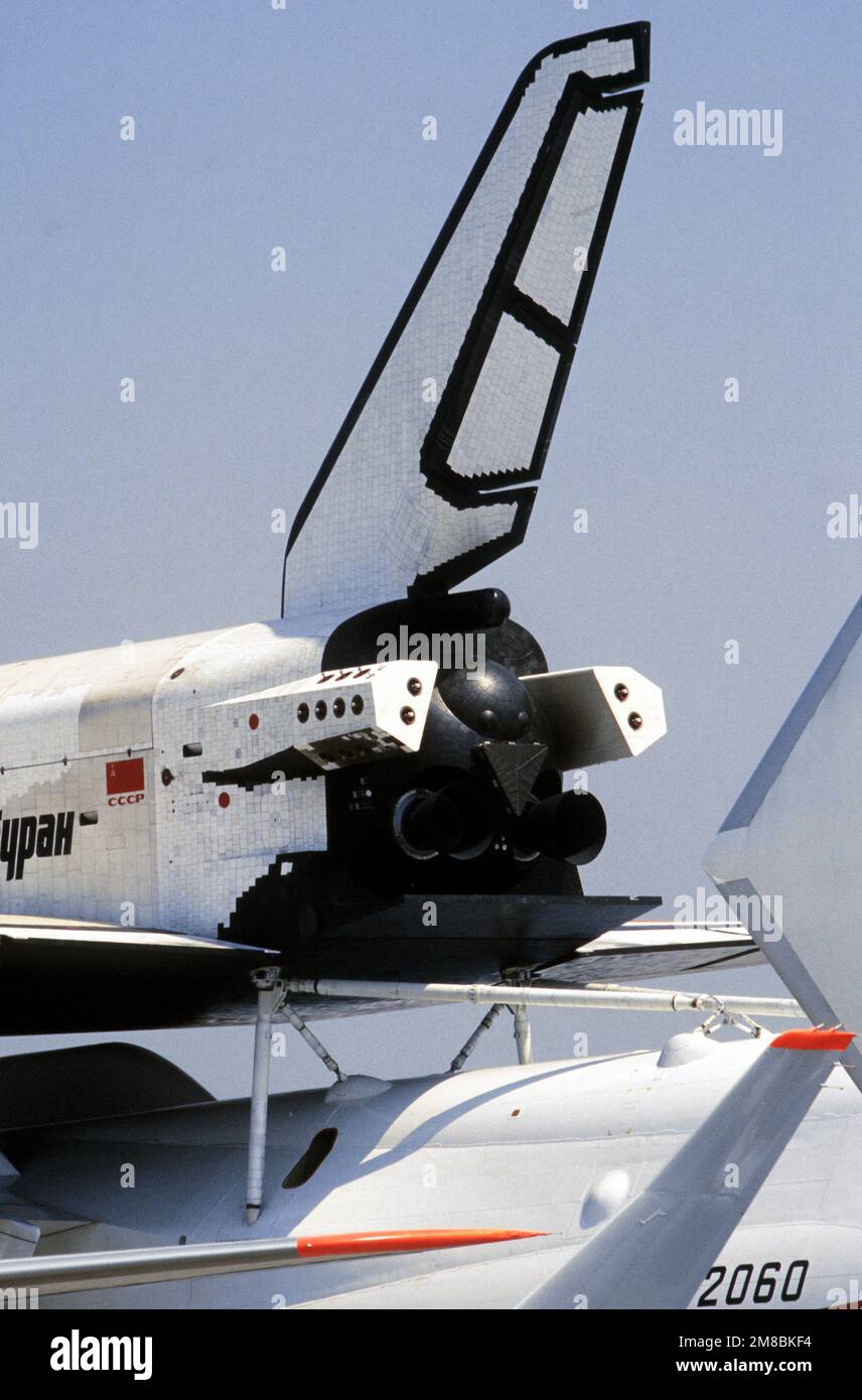 A partial rear view of the Soviet space shuttle Buran atop an An-225 ...