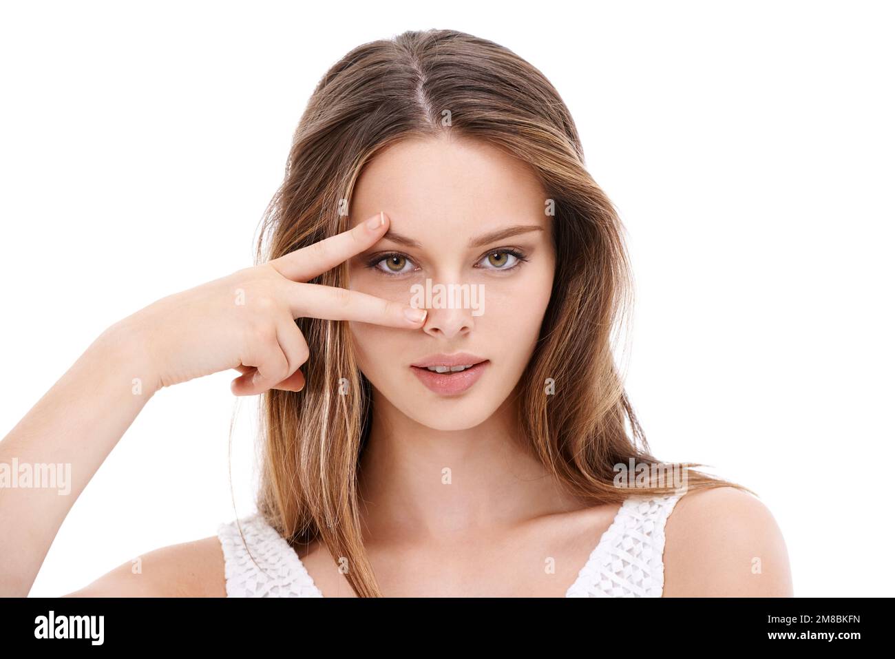 Portrait, hand and eyes with a model woman in studio on a white ...