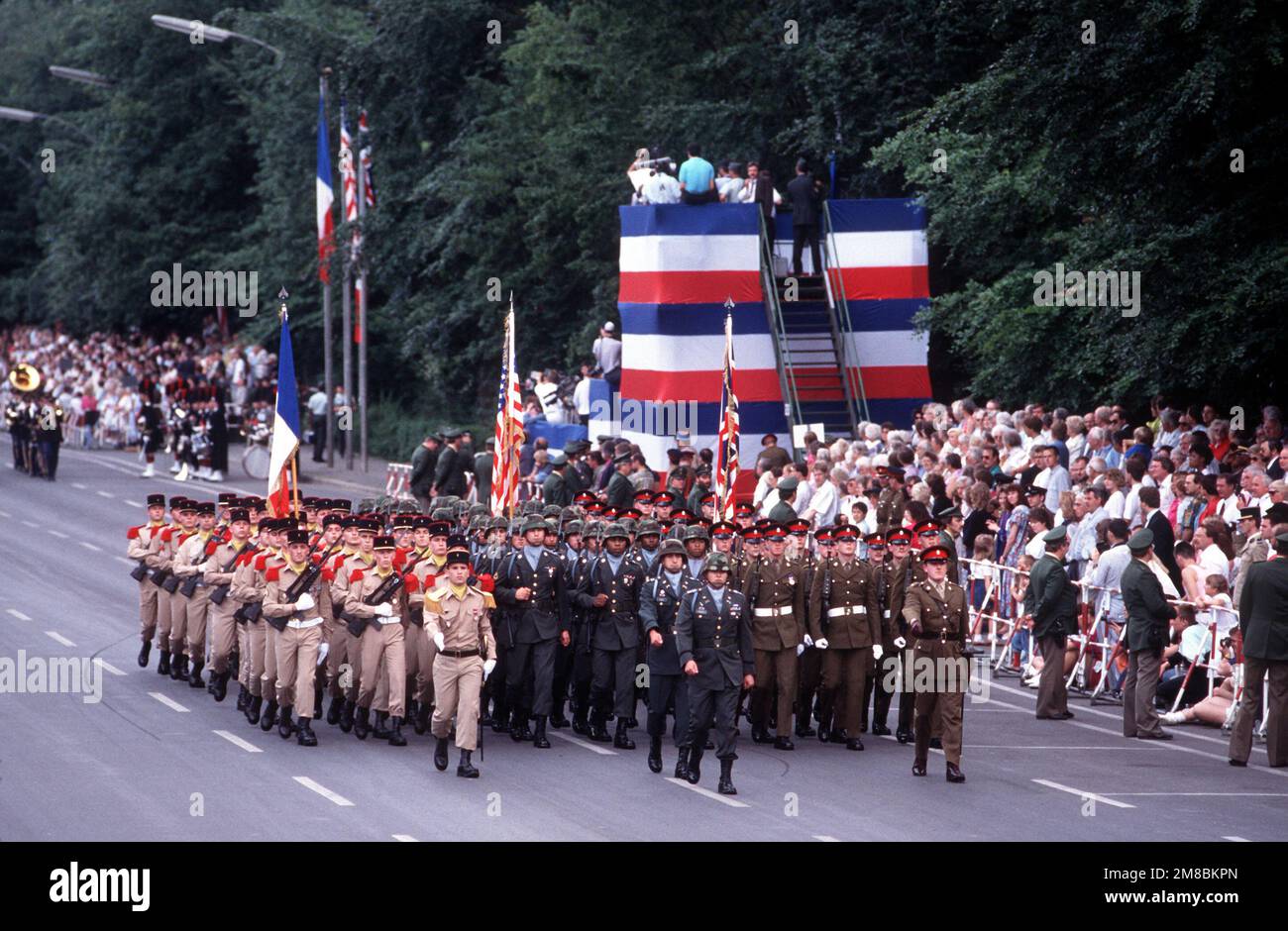 A combined French, American and British color guard marches along 17th ...
