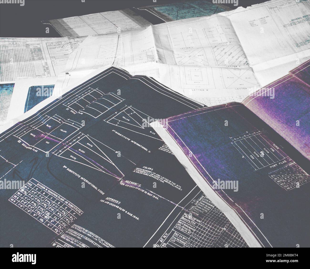 Blueprints used in the fabrication of signal flags are laid out on a ...