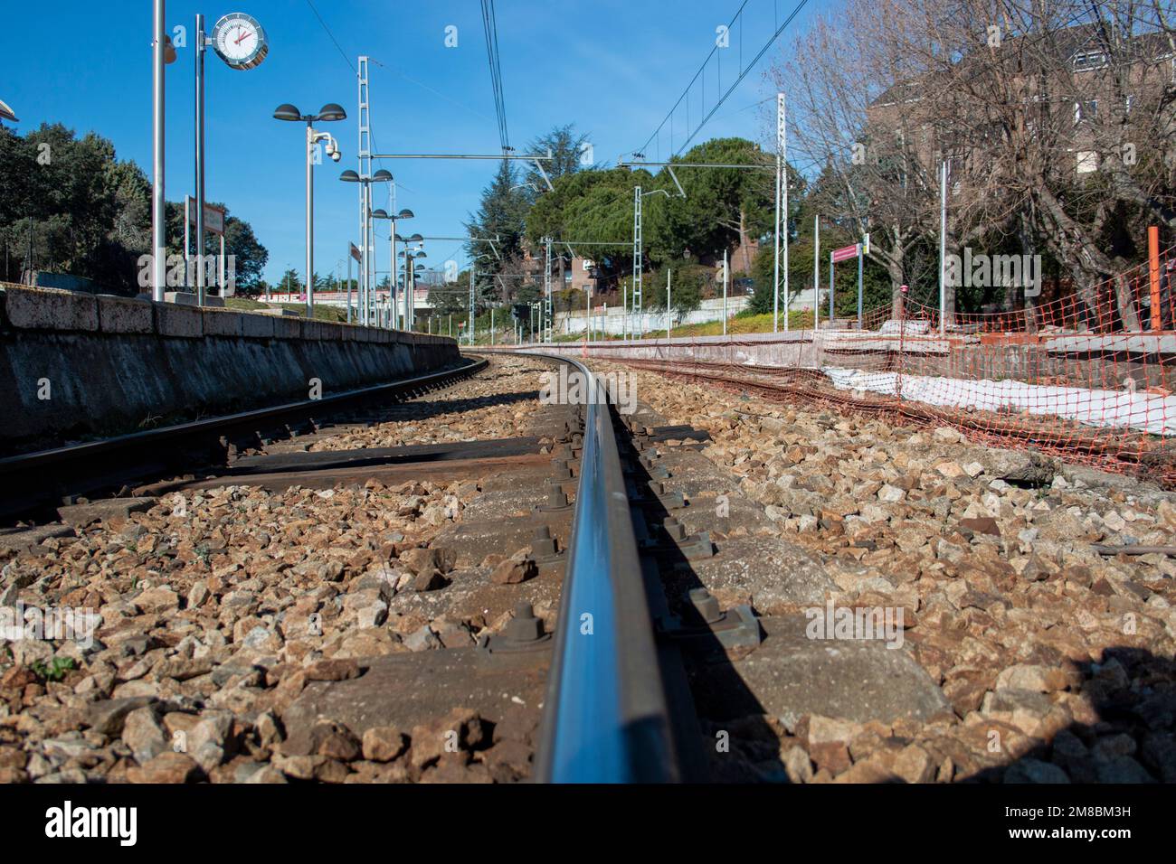 Train track rail in a very close plane on the station platform where ...