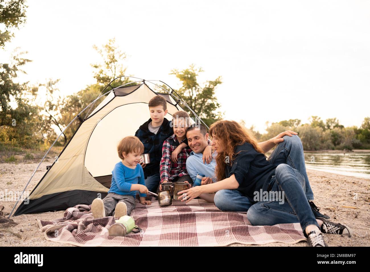 Camping, travel, tourism, hiking and people concept. Big family with ...
