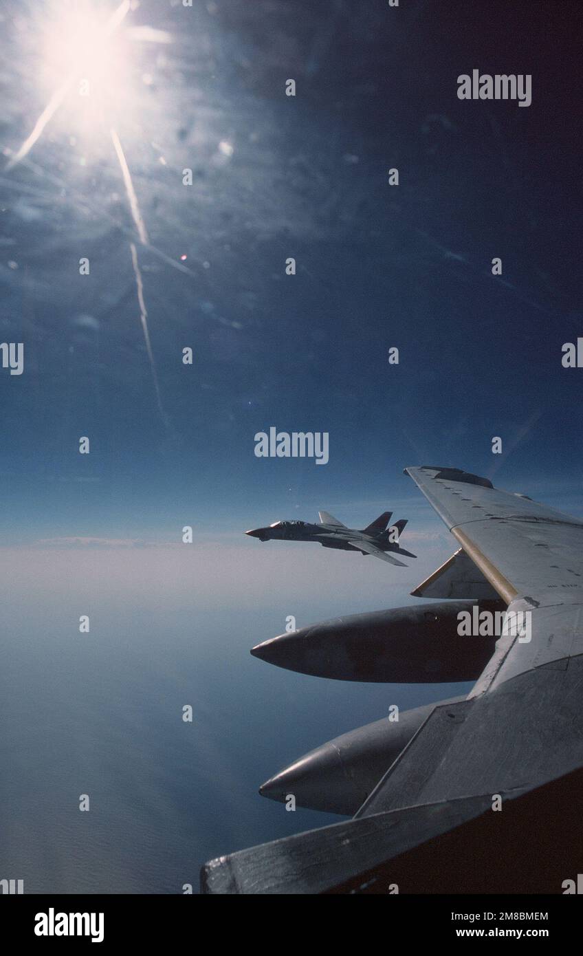An F-14A Tomcat aircraft from Fighter Squadron 31 (VF-31) flies near ...