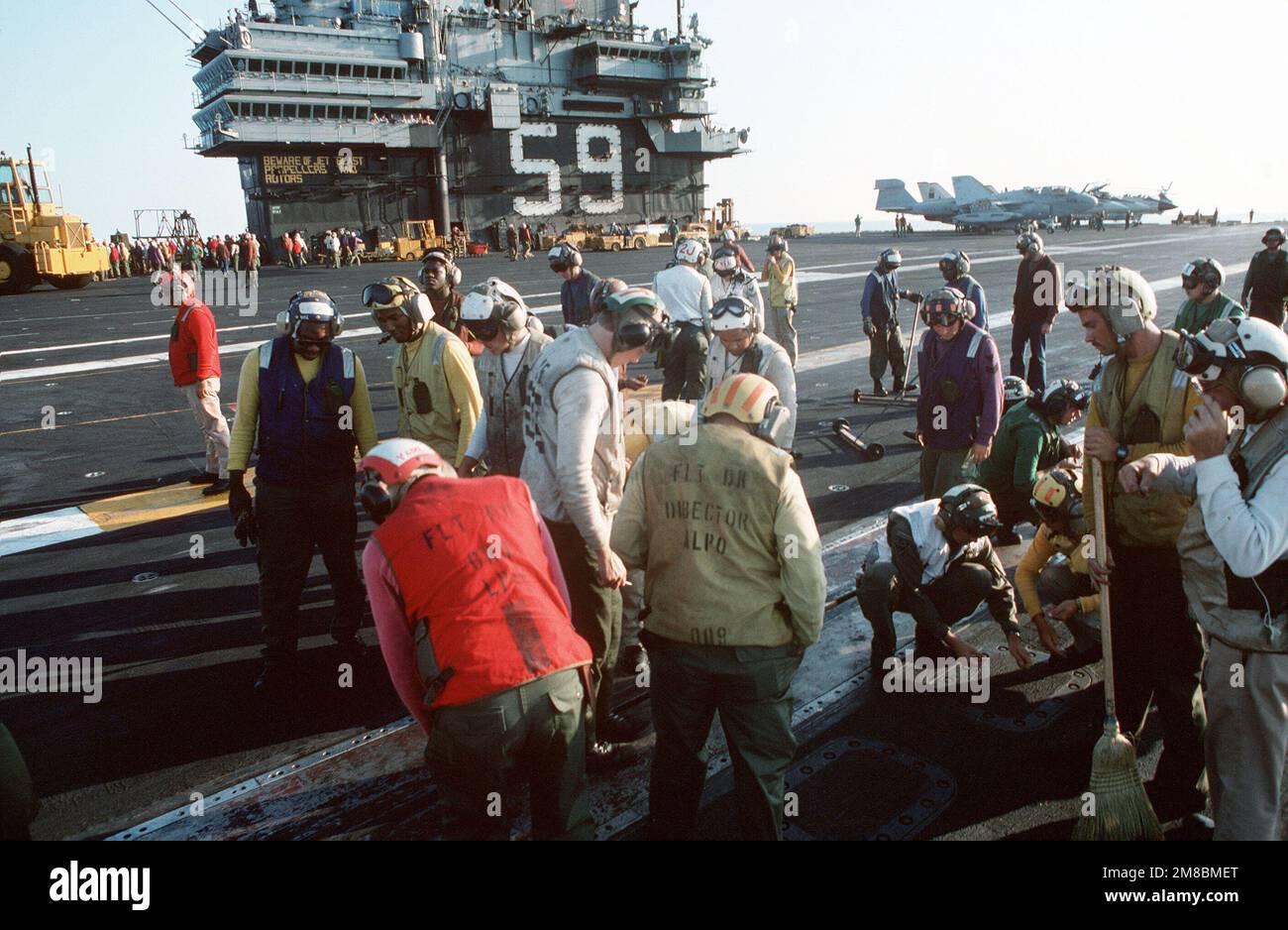 Flight deck personnel aboard the aircraft carrier USS FORRESTAL (CV 59 ...