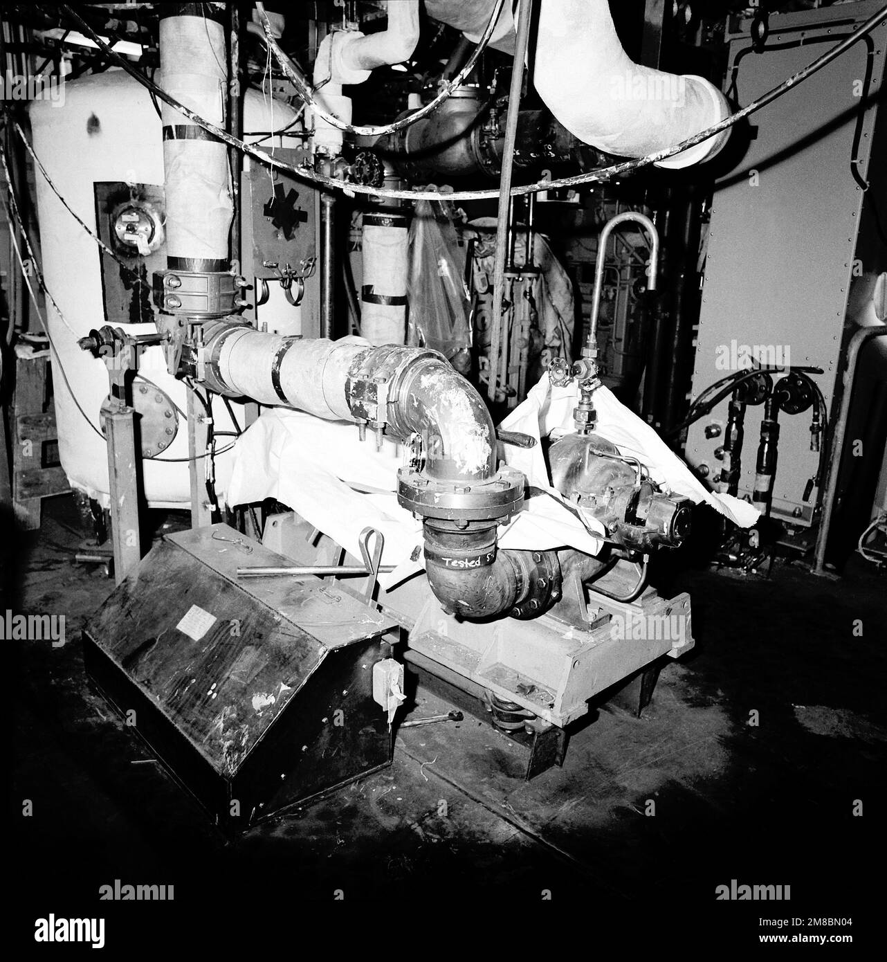 A view of auxiliary engine room No. 1 aboard the guided missile cruiser ...