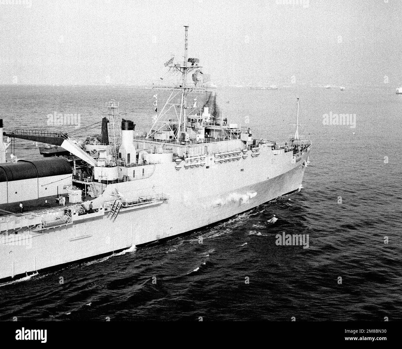 A partial starboard view of the amphibious transport dock USS OGDEN ...