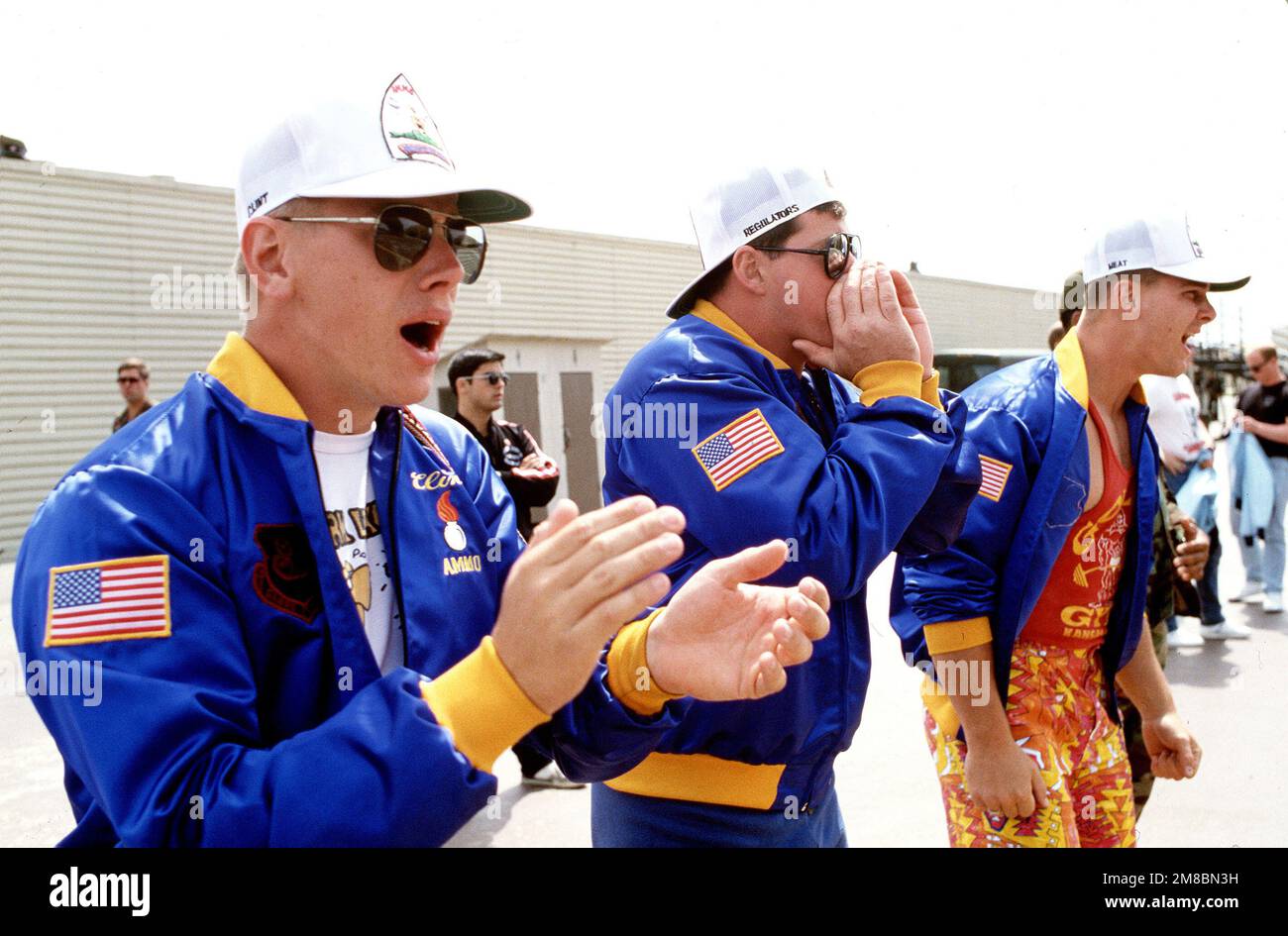 Participants in a combat aircraft servicing (CAS) competition encourage ...