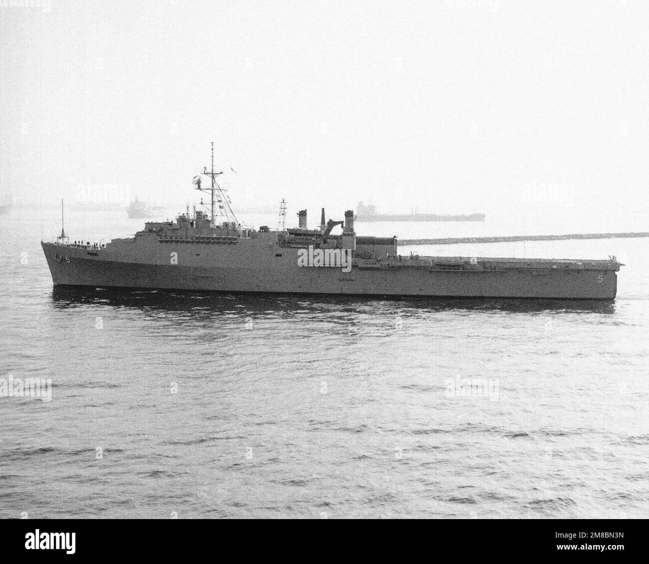 A port beam view of the amphibious transport dock USS OGDEN (LPD 5 ...