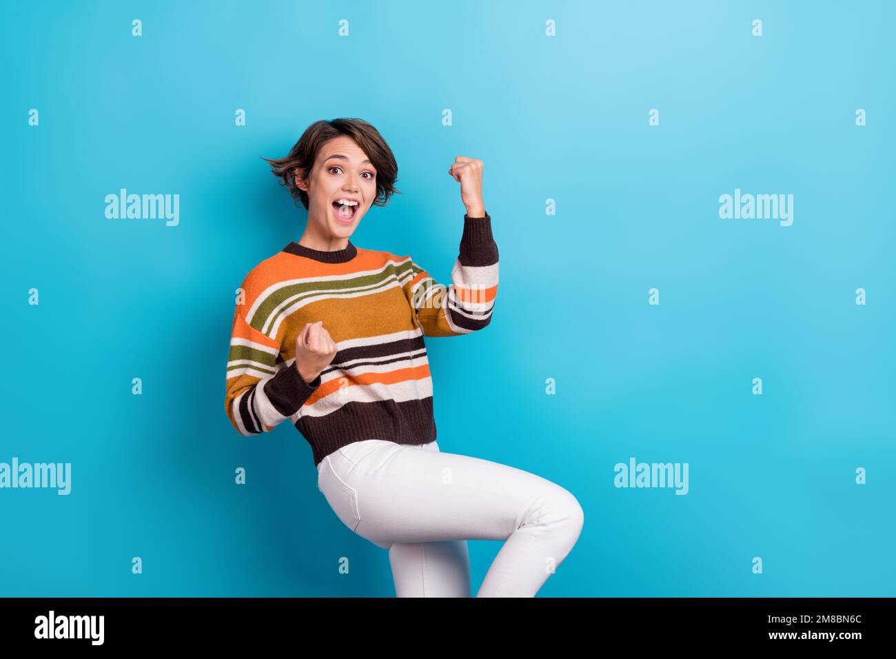 Photo of impressed funny girl with short hairstyle dressed striped ...