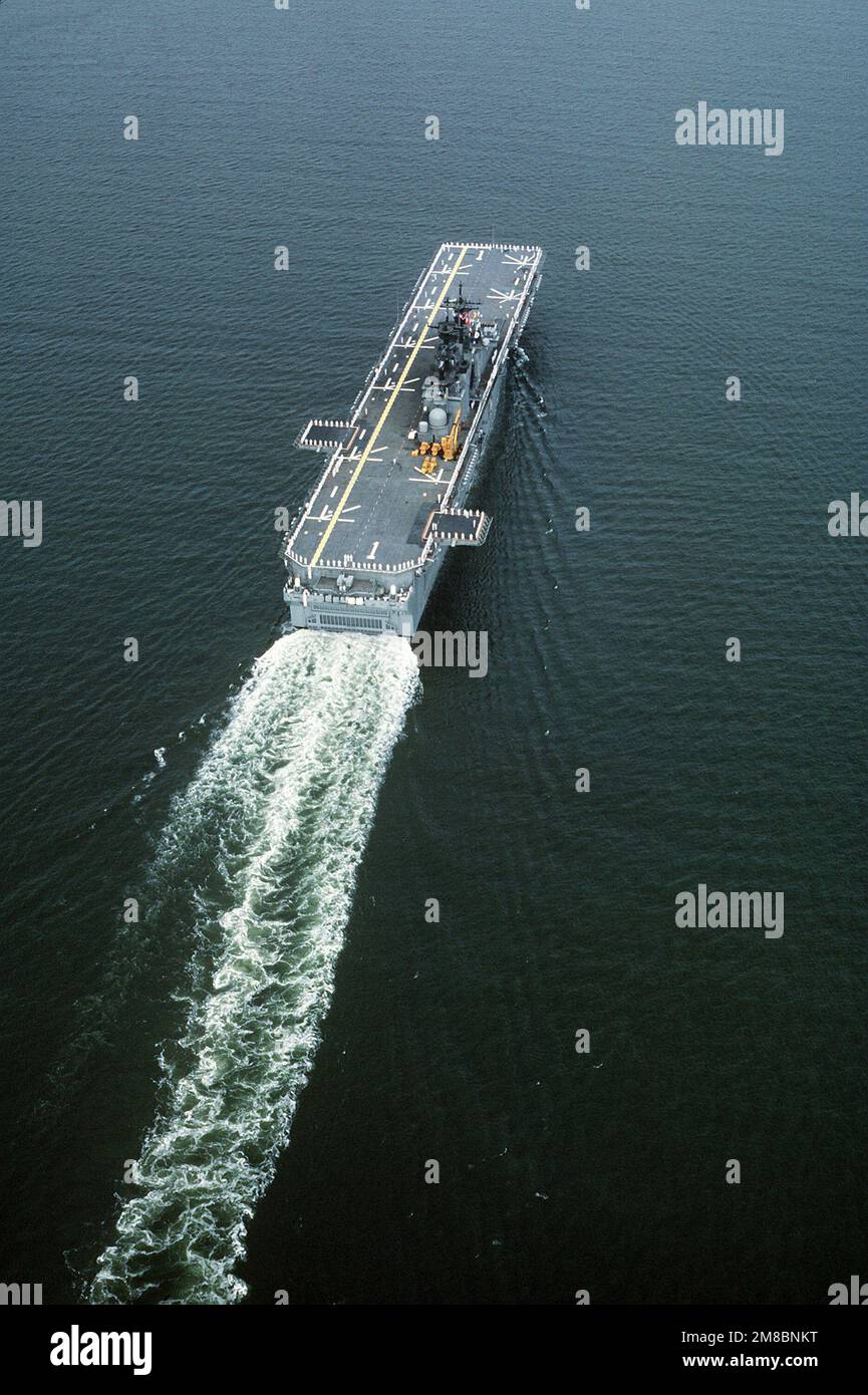 An aerial view of crewmen manning the rails aboard the amphibious ...