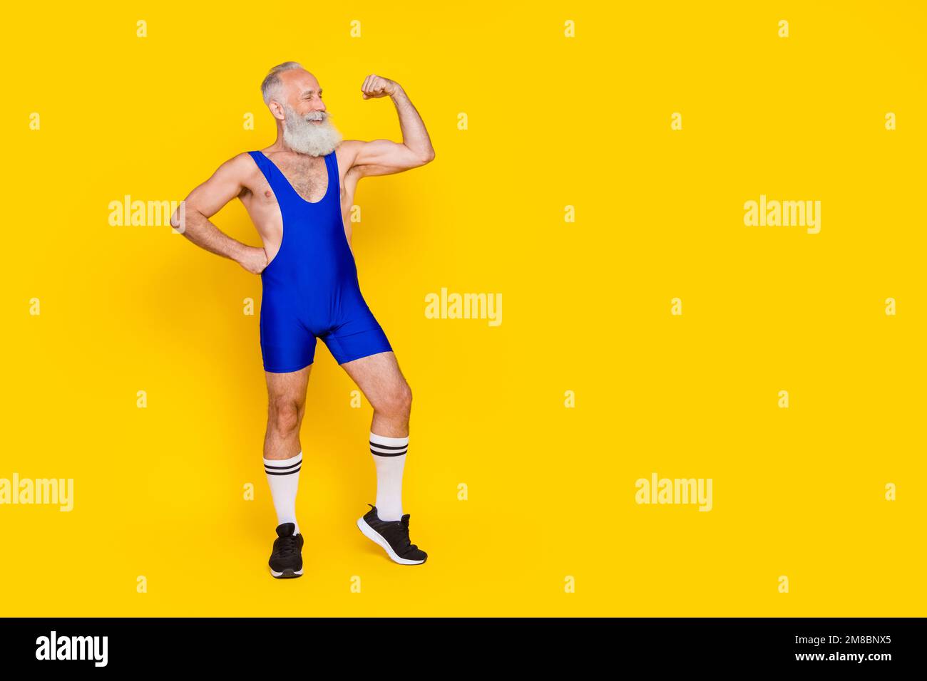 Full length photo of strong cheerful senior guy wear blue overall ...