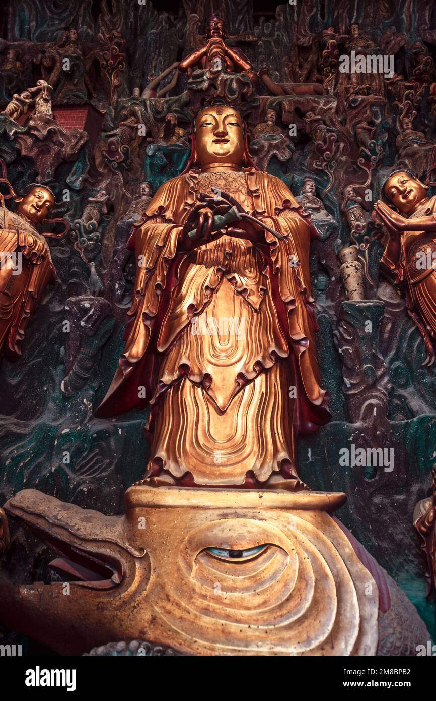 A vertical shot of a traditional Asian statue Stock Photo - Alamy