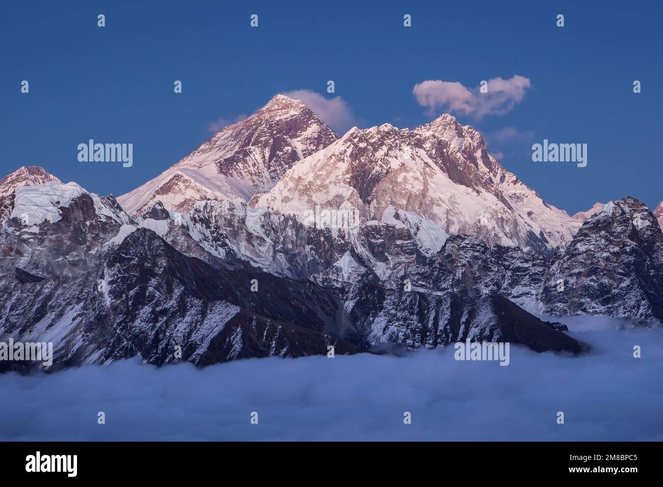 Breathtaking sunset over Mount Everest summit colored in an ...