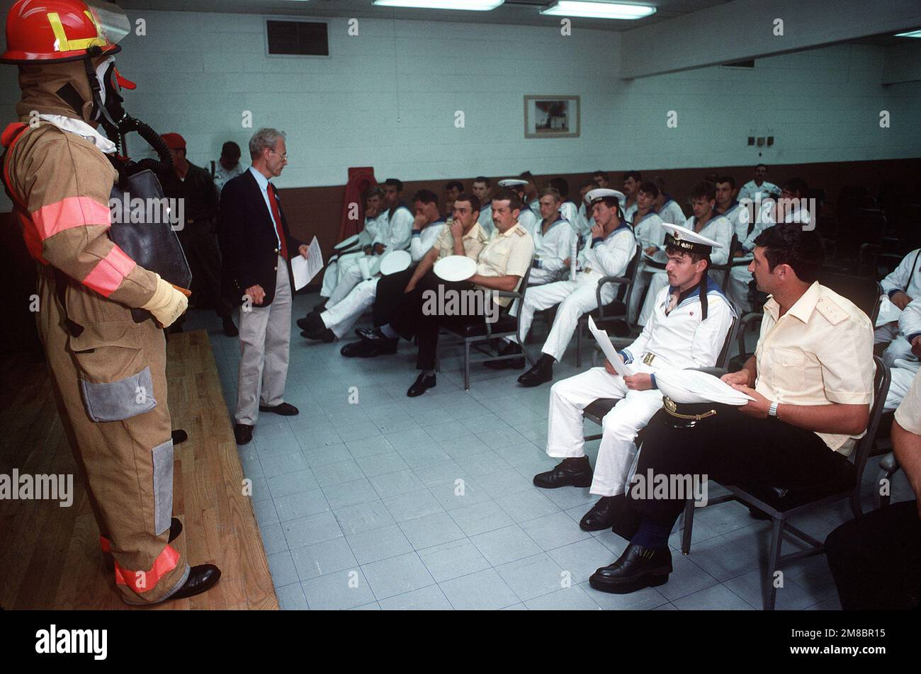 An American sailor wearing protective gear and an oxygen breathing ...
