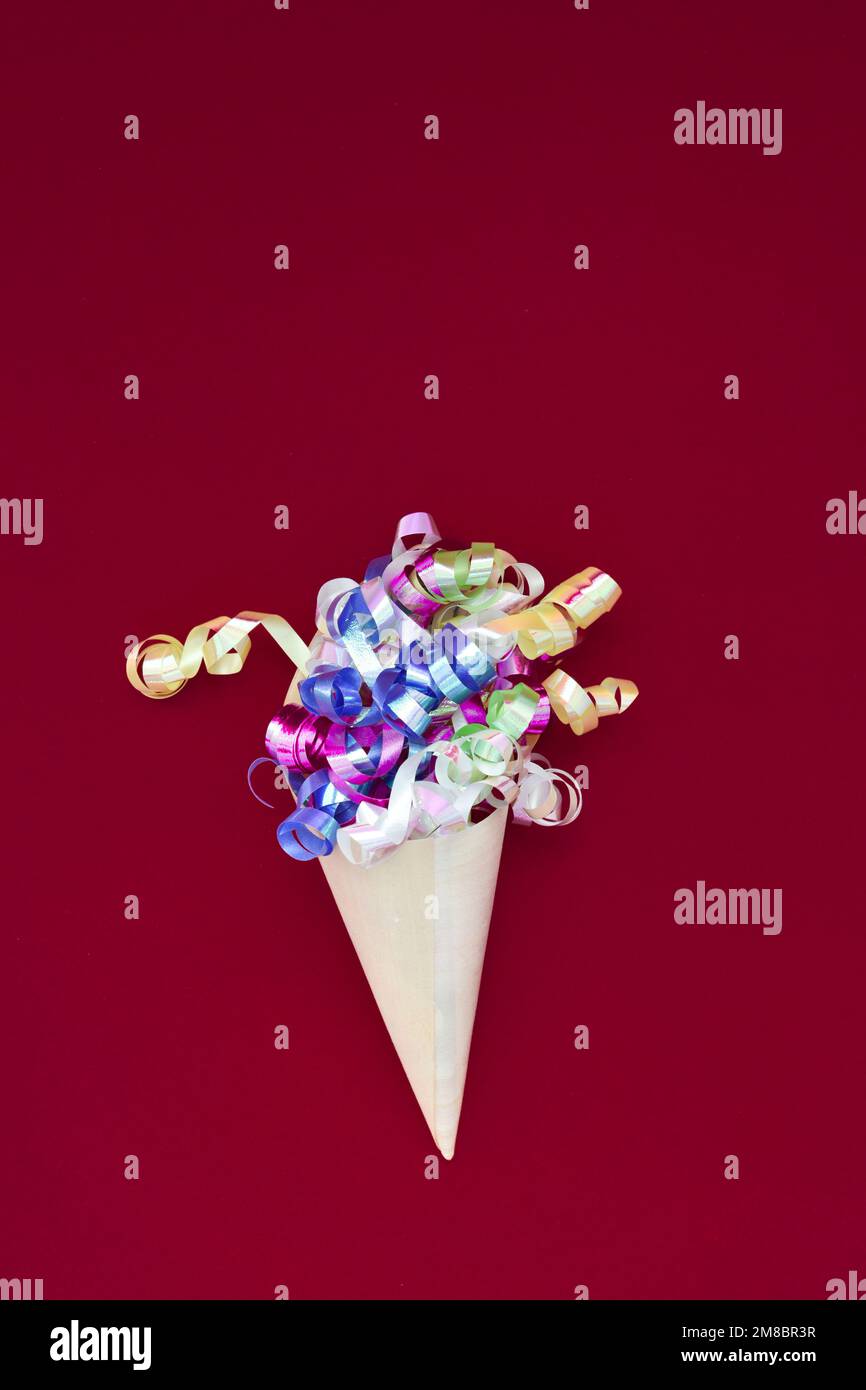 Paper cone with colorful party streamers Viva Magenta background Stock ...