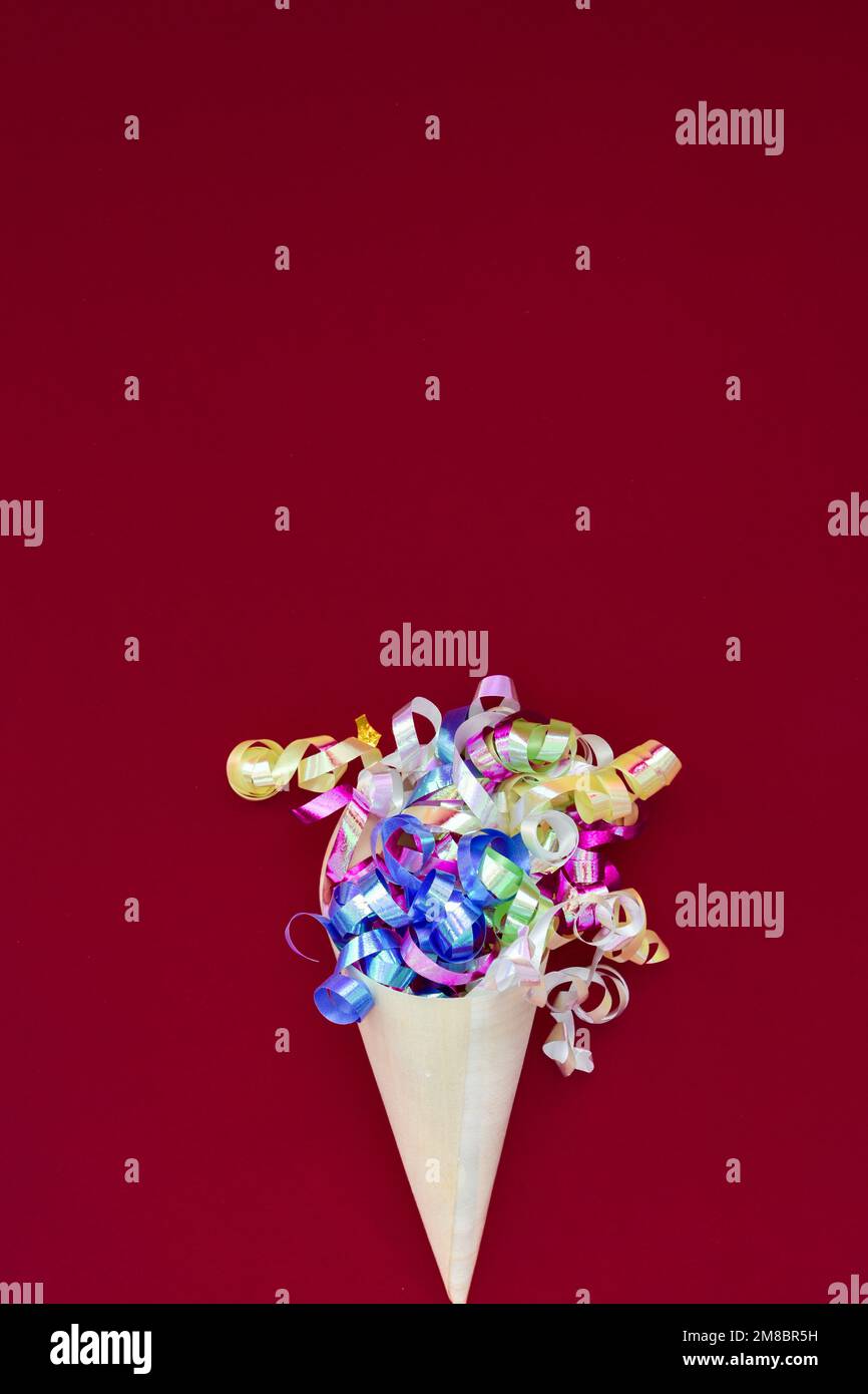 Paper cone with colorful party streamers Viva Magenta background Stock ...