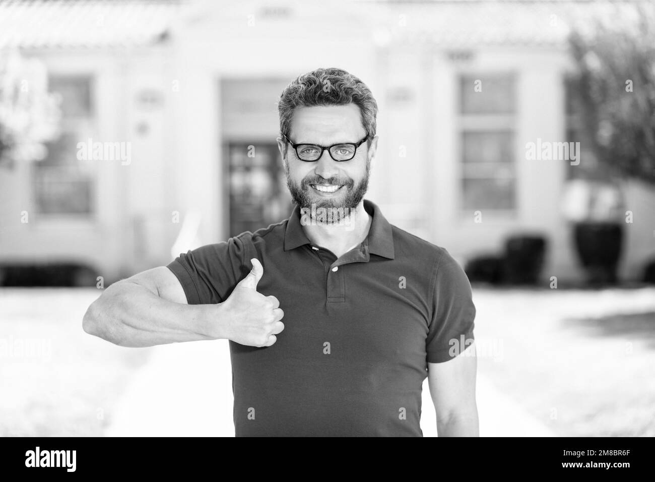 good eye health of happy guy in glasses with thumb up gesture, eye care ...