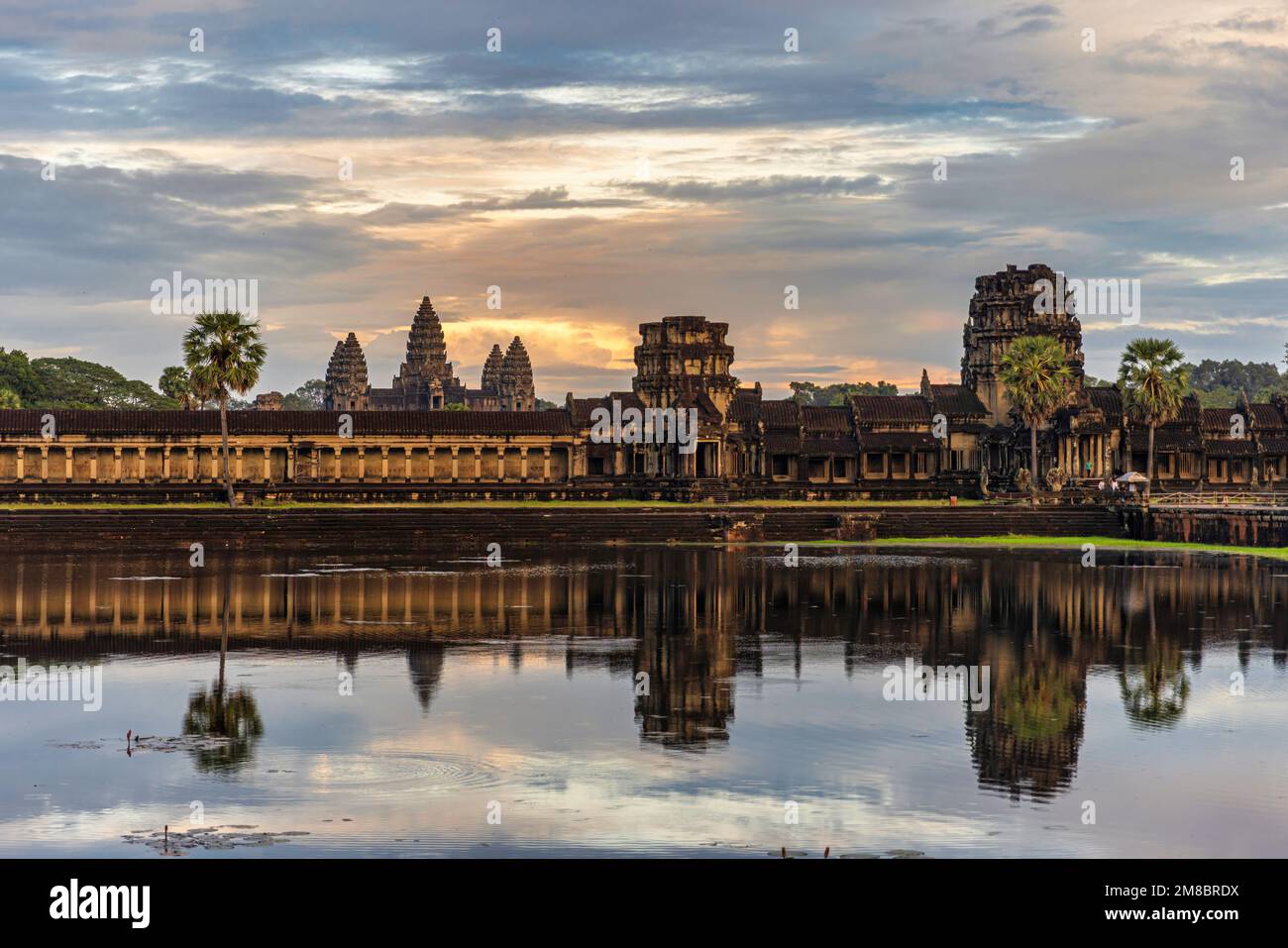 Angkor Wat temple with sunset sky reflecting in water Stock Photo - Alamy
