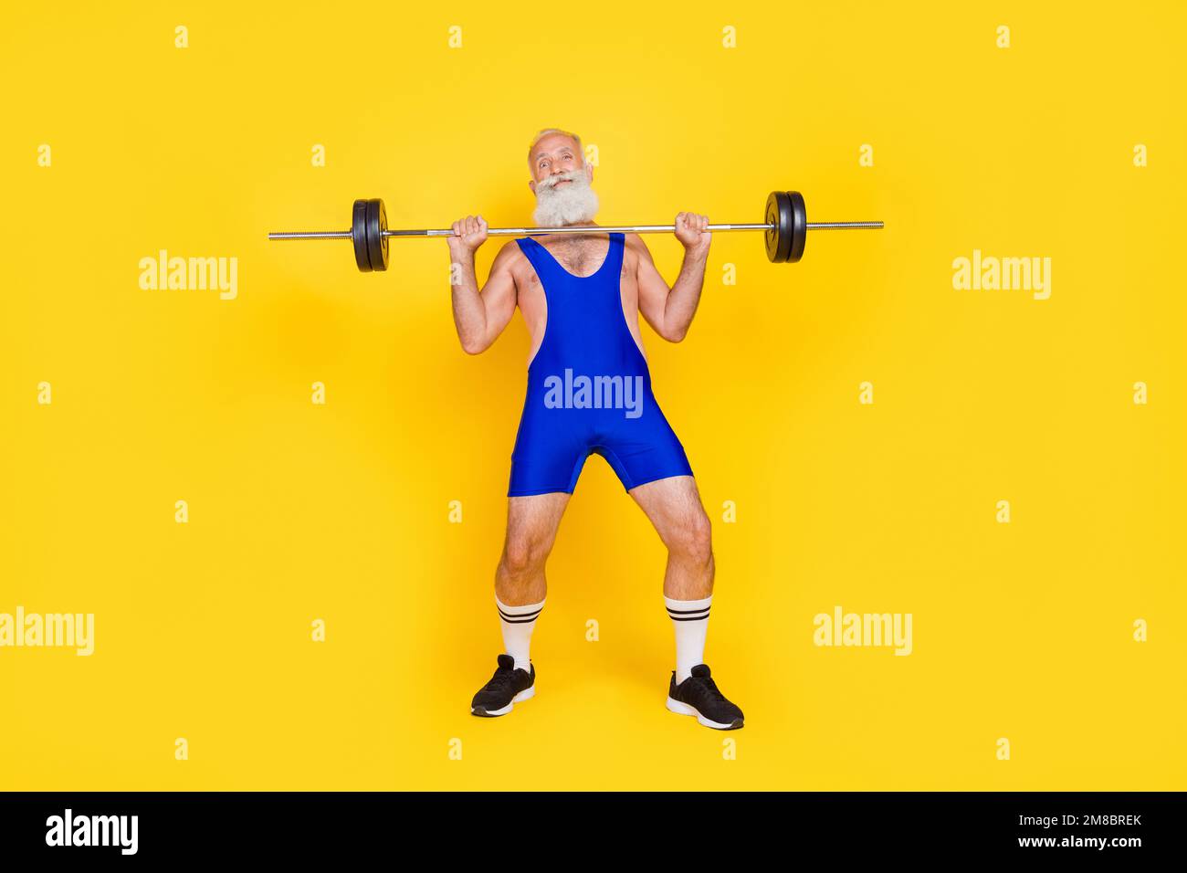Full body size photo of funky comic grandfather trying hard dumbbell up ...