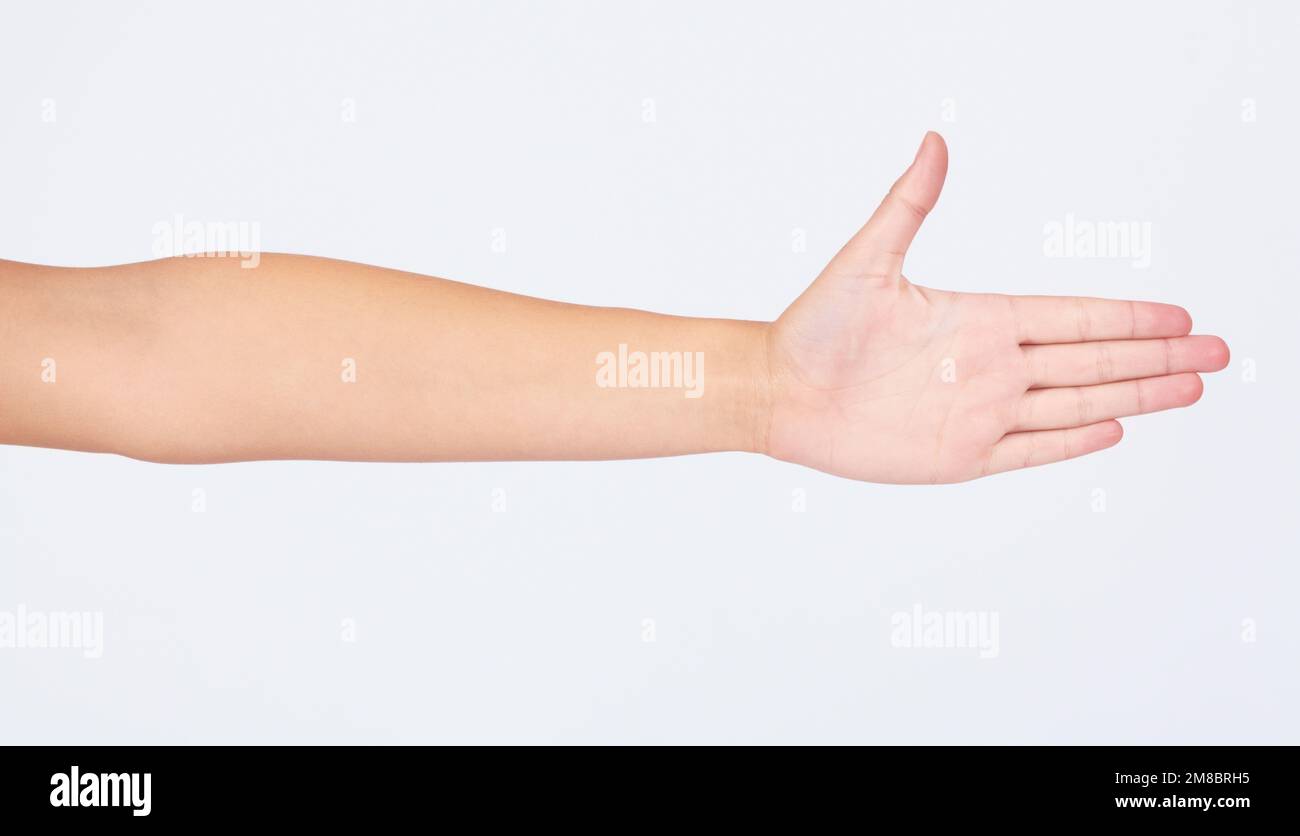 Woman, handshake or greeting on studio background in success goals ...