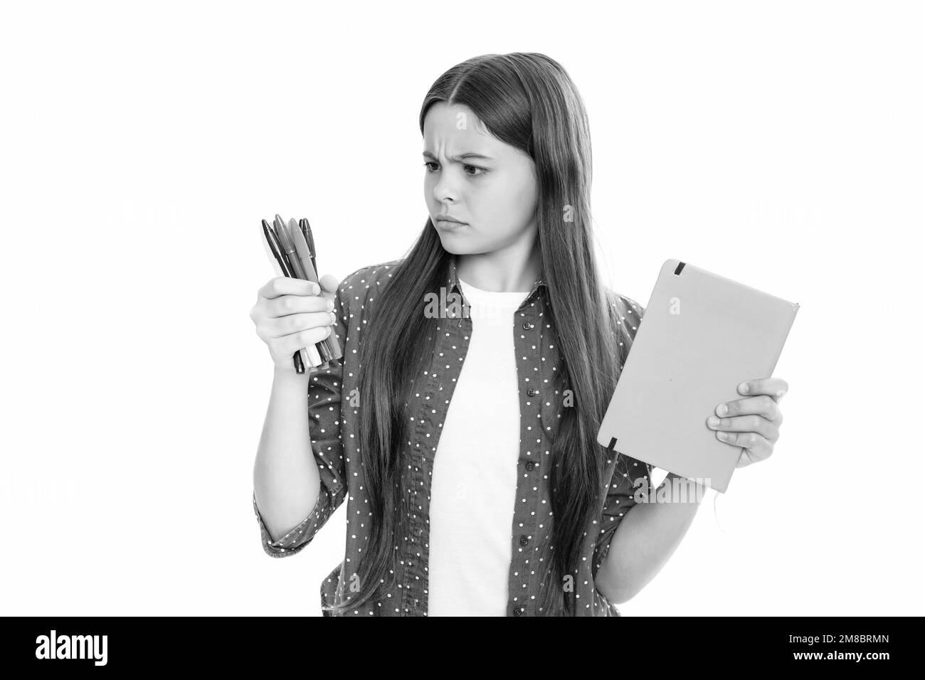 Teenage school girl with books. Schoolgirl student. Angry teenager girl ...