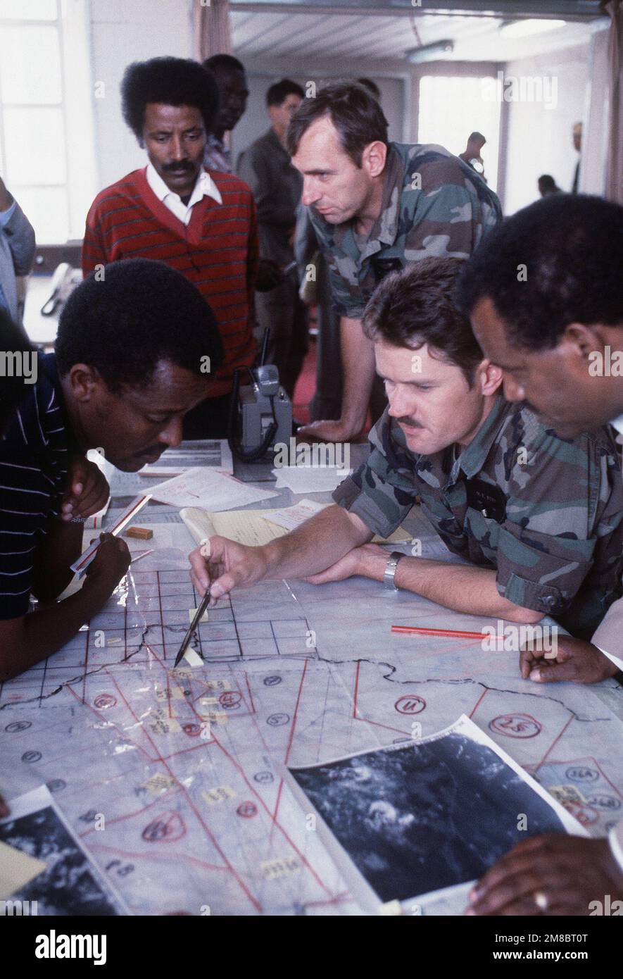 Members of the 67th Special Operations Squadron plan the following day ...
