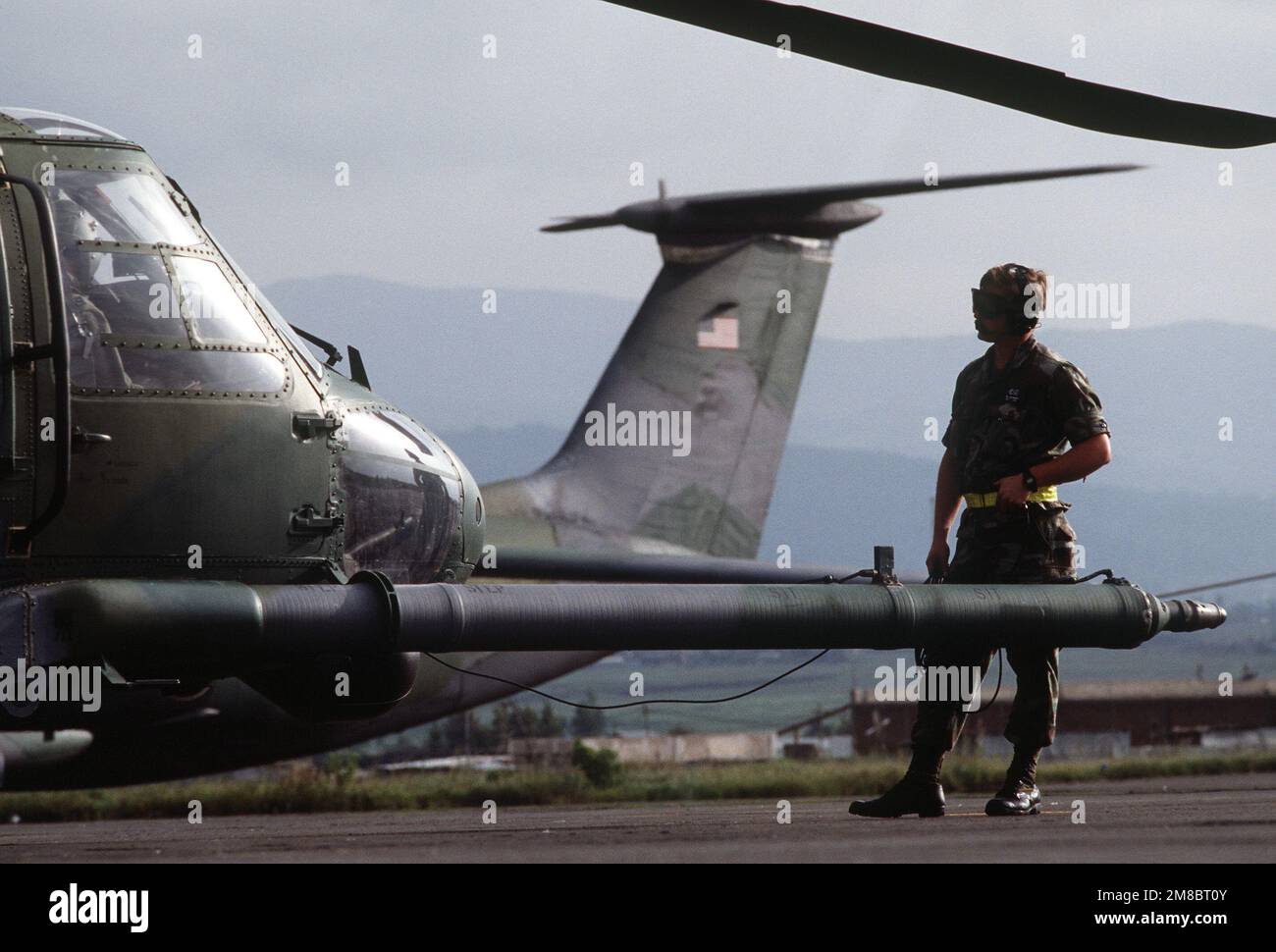 A ground crew member stands by a 55th Special Operations Squadron HH ...